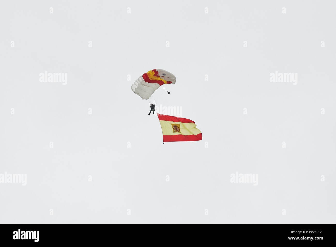 A Spanish paratrooper waves a Spanish flag during Spanish National Day ...