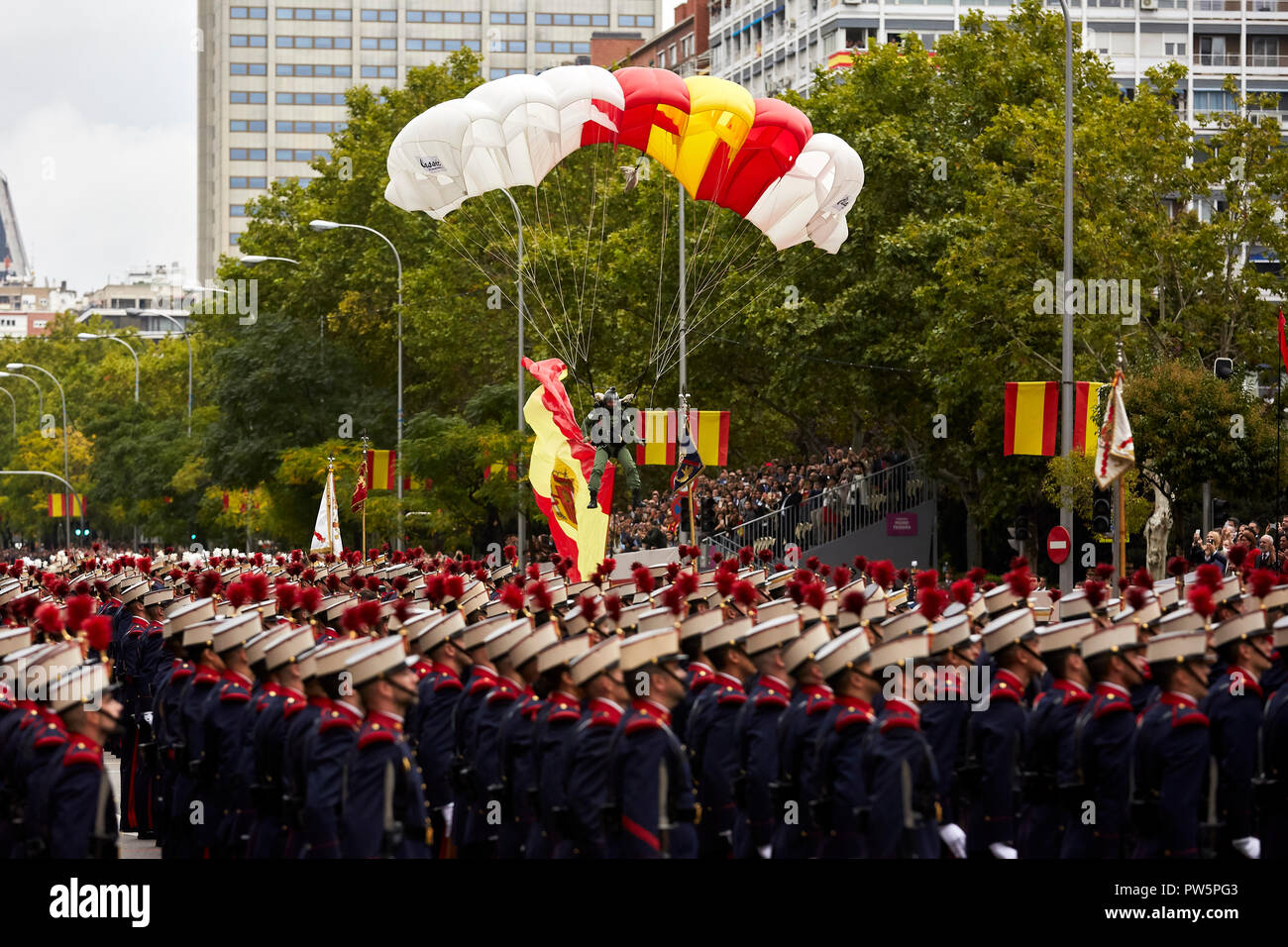 A Spanish paratrooper waves a Spanish flag during Spanish National Day ...