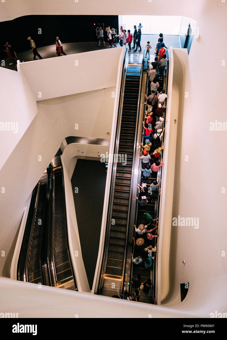 Kaohsiung, Taiwan. 13th Oct, 2018. Visitors traveling up an escalator ...