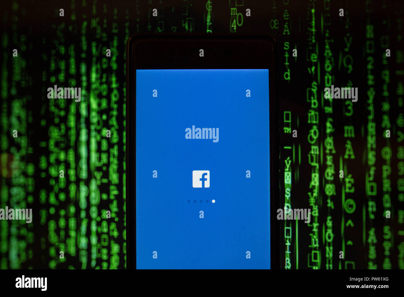 The Facebook logo seen displayed on a smartphone Stock Photo - Alamy