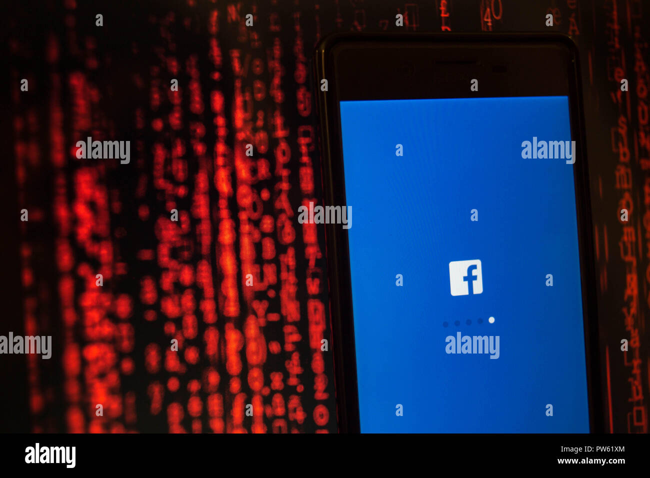 The Facebook logo seen displayed on a smartphone Stock Photo - Alamy