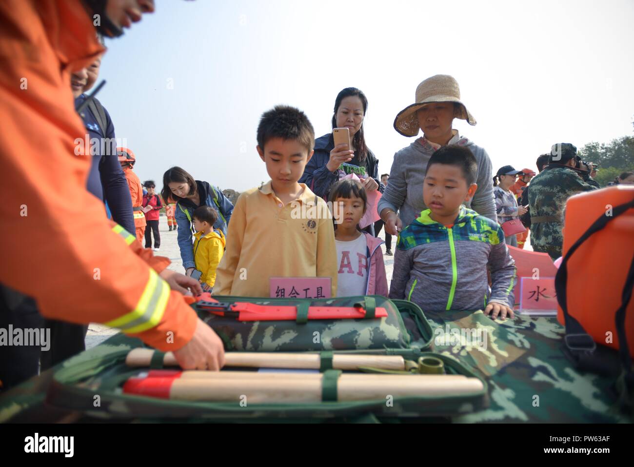 Beijing, China. 13th Oct, 2018. Forest firefighters introduce equipment ...