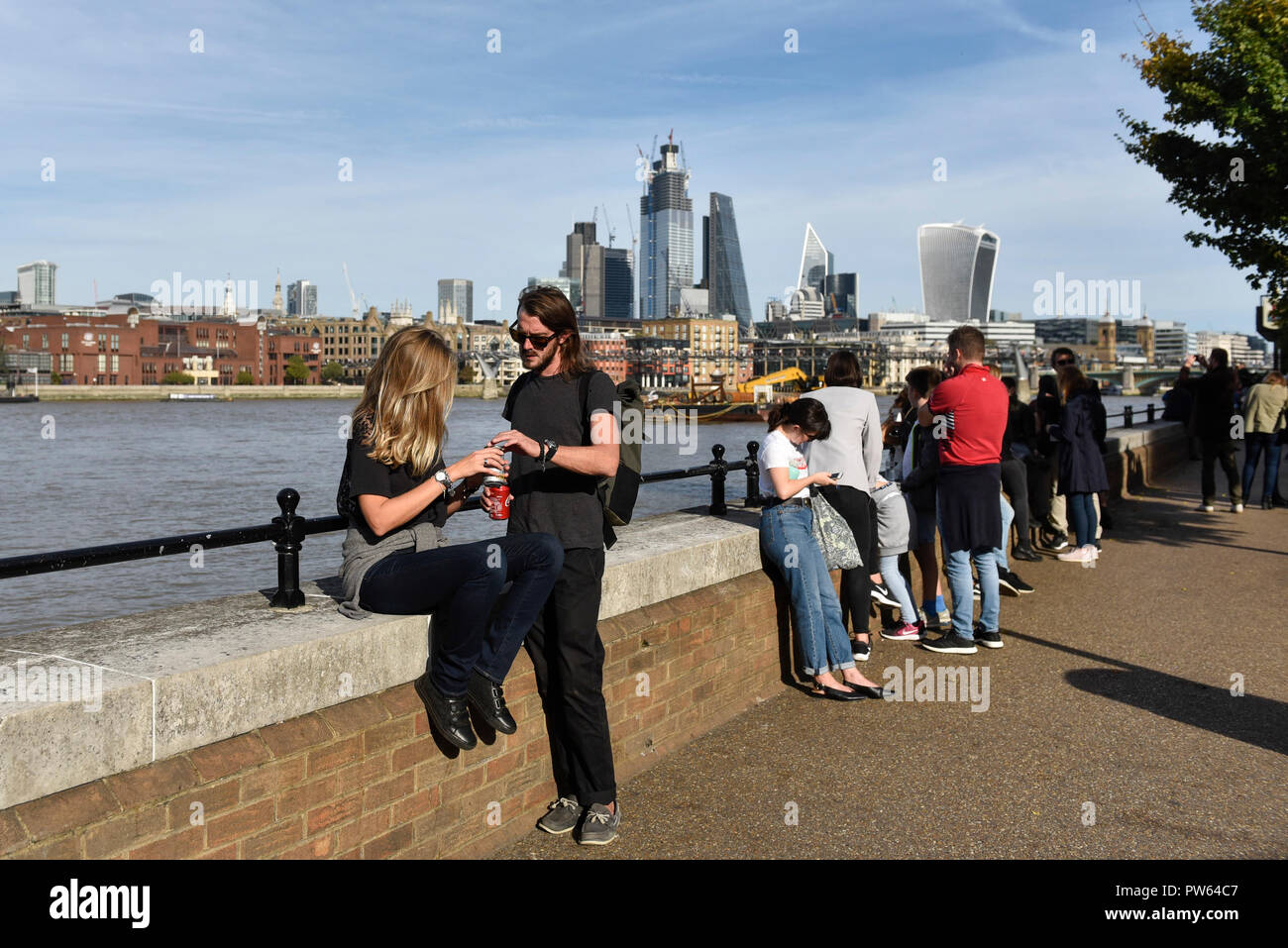 London, UK. 13 October 2018. UK Weather - People on the South Bank ...