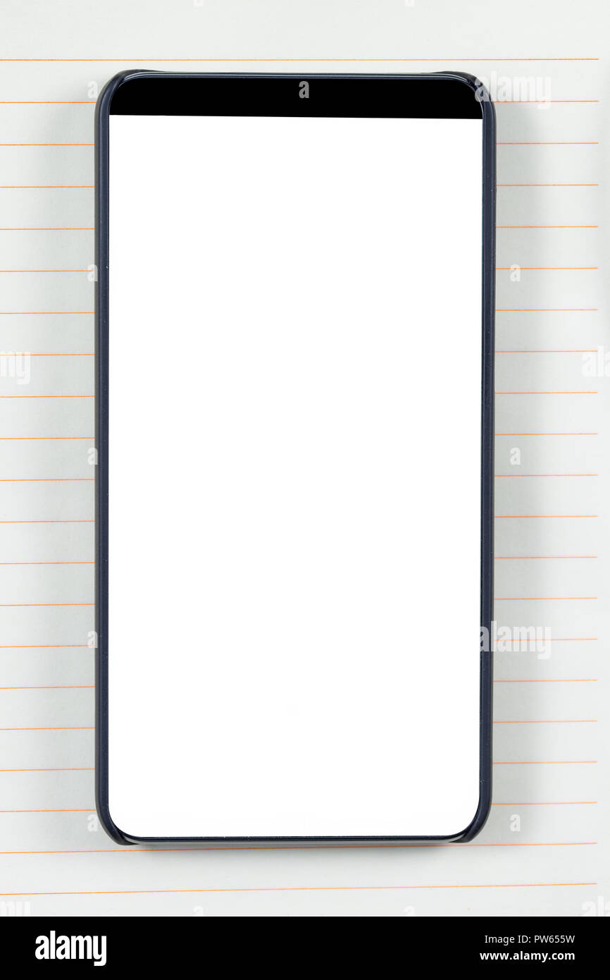 Bezel less smartphone with blank screen on a notepad background. Ready ...