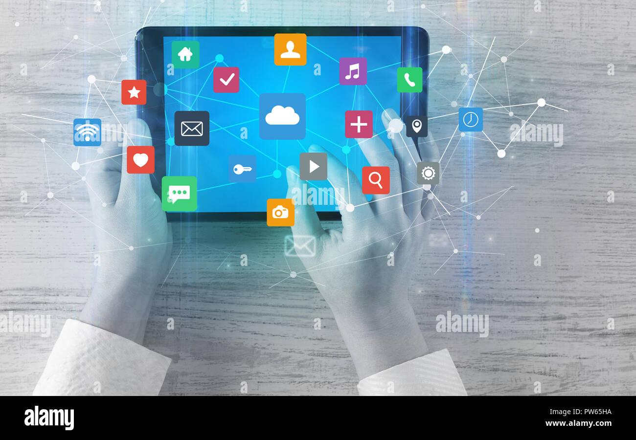 Hand touching multitask tablet with cloud wifi message social media ...