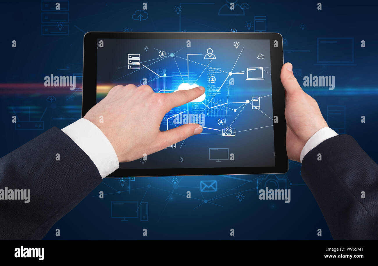 First person view of a hand using tablet with cloud office concept ...
