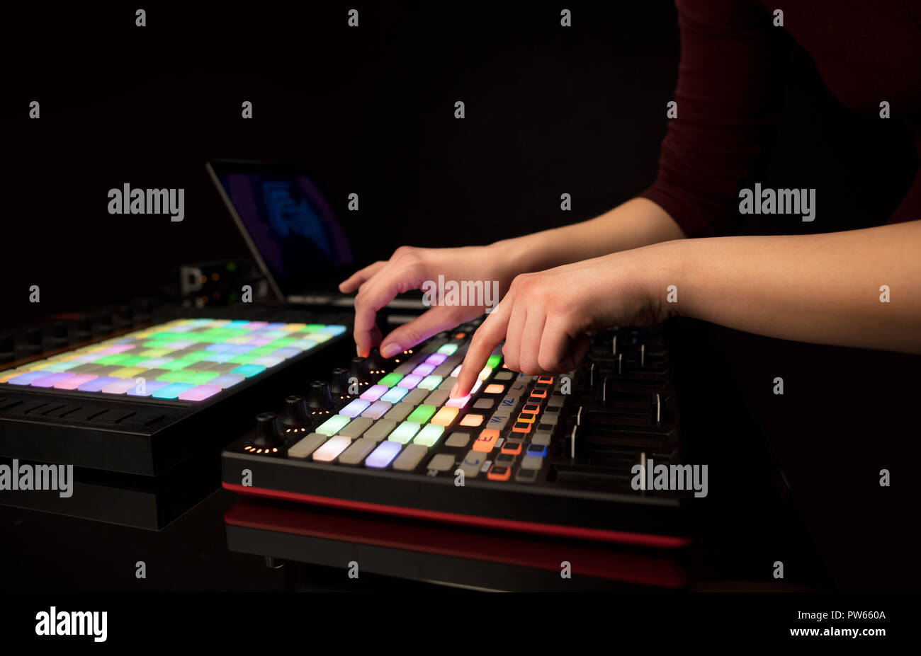 Dj hand remixing music on midi controller Stock Photo - Alamy