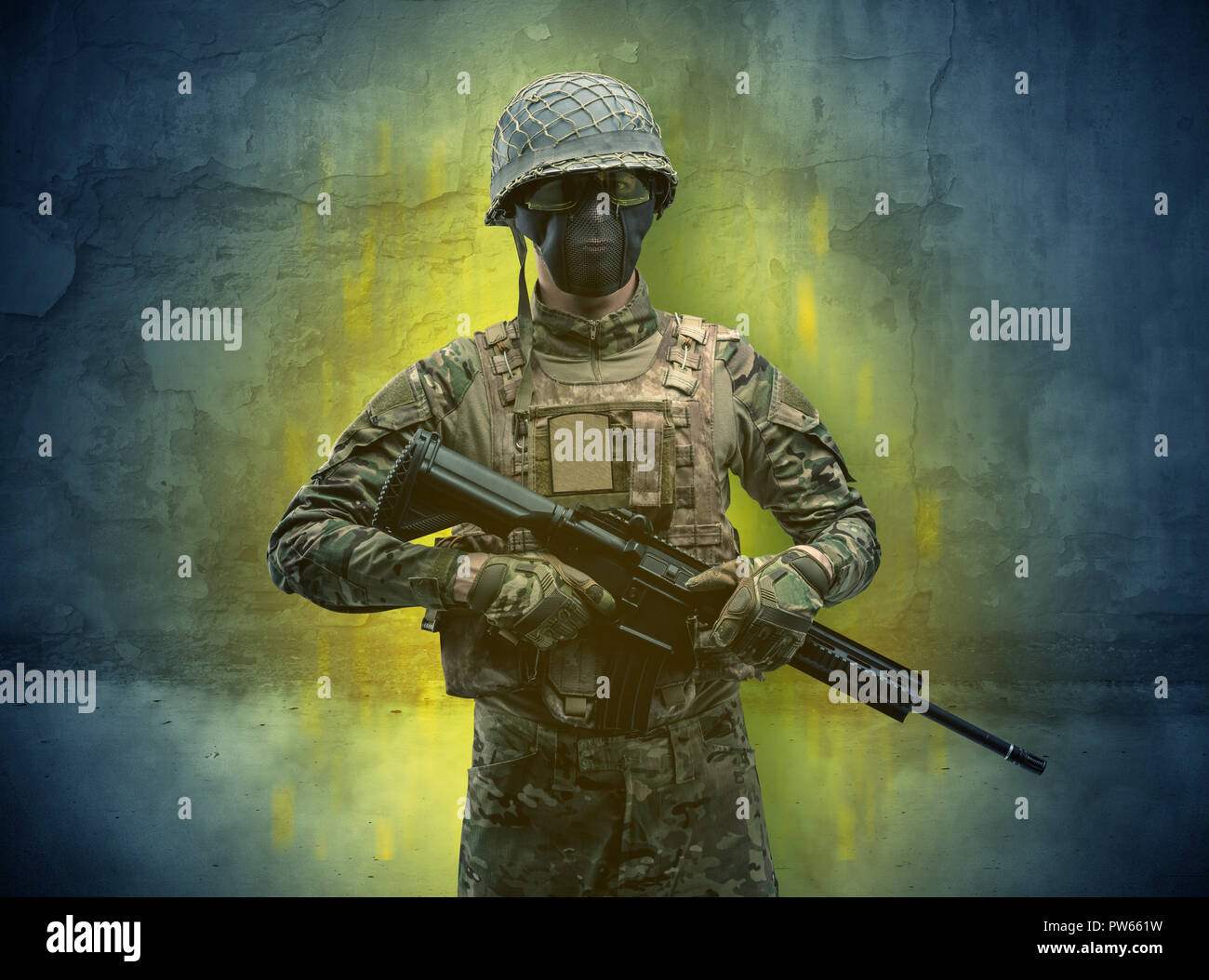 Hazard, menace soldier in a ruined crumbly building with arms on his ...