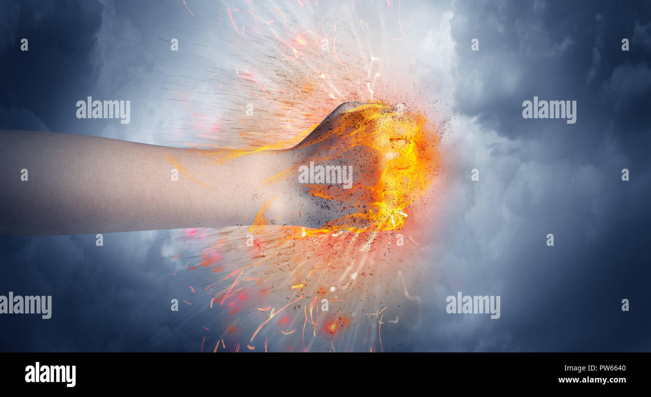 Hand hits strongly and makes fire beam around Stock Photo - Alamy