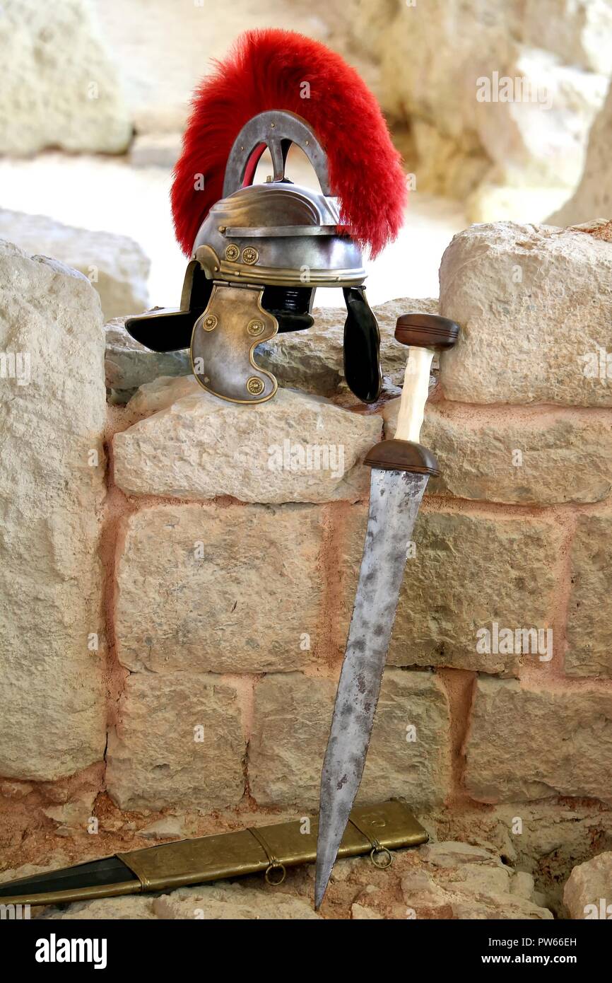 Roman guard helmet with red crest, and short sword or "gladius ...