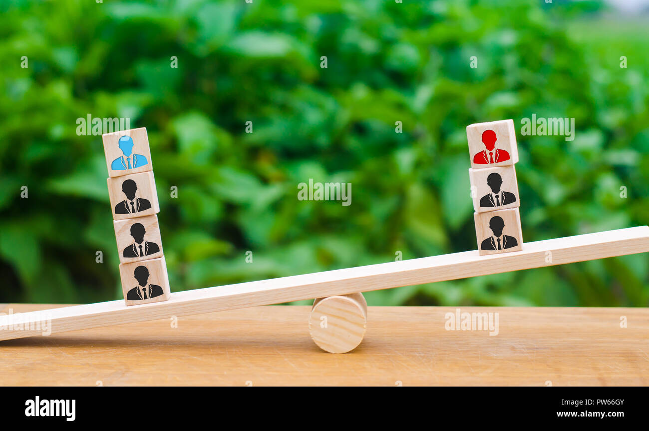 Cubes with pictures of employees on the scales. The concept of ...