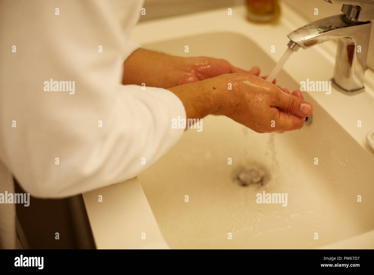 Hygiene. Cleaning Hands. Washing hands with soap under the faucet with ...
