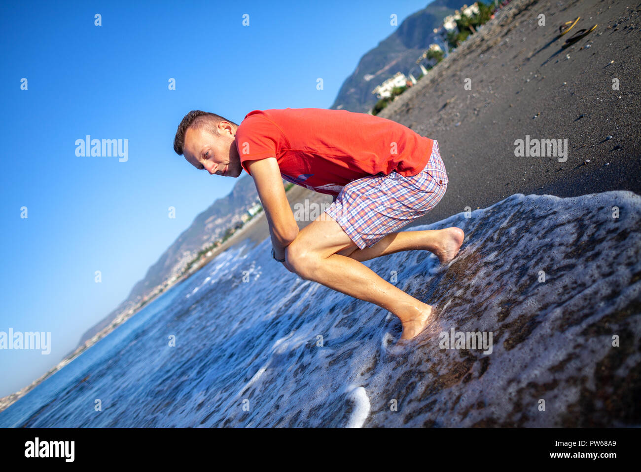 Male model at beach hi-res stock photography and images - Alamy
