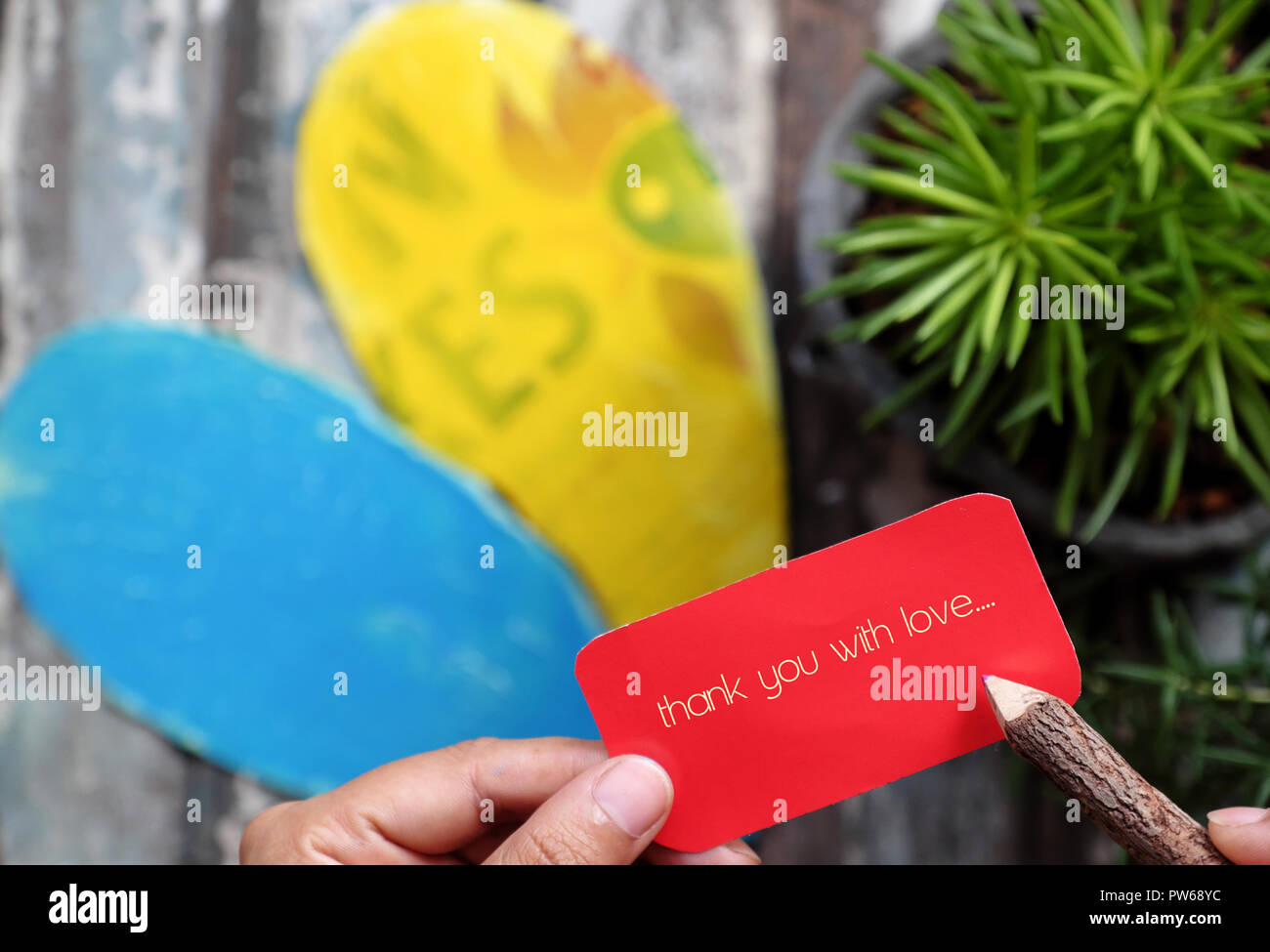 Thank you background with human hand hold the red note paper with thank ...