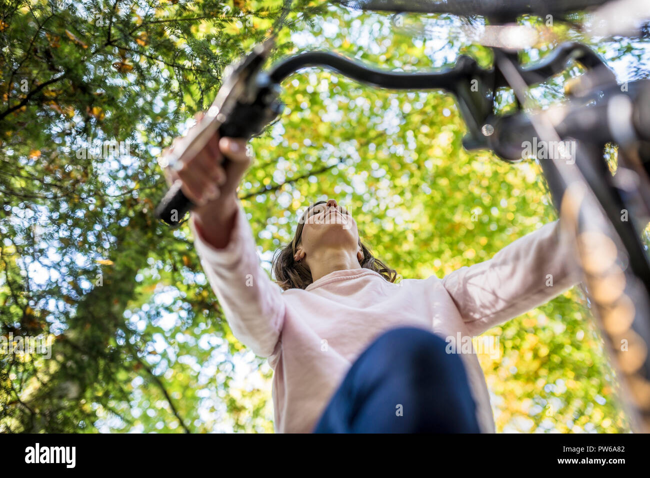 Girl riding bicycle low angle hi-res stock photography and images - Alamy