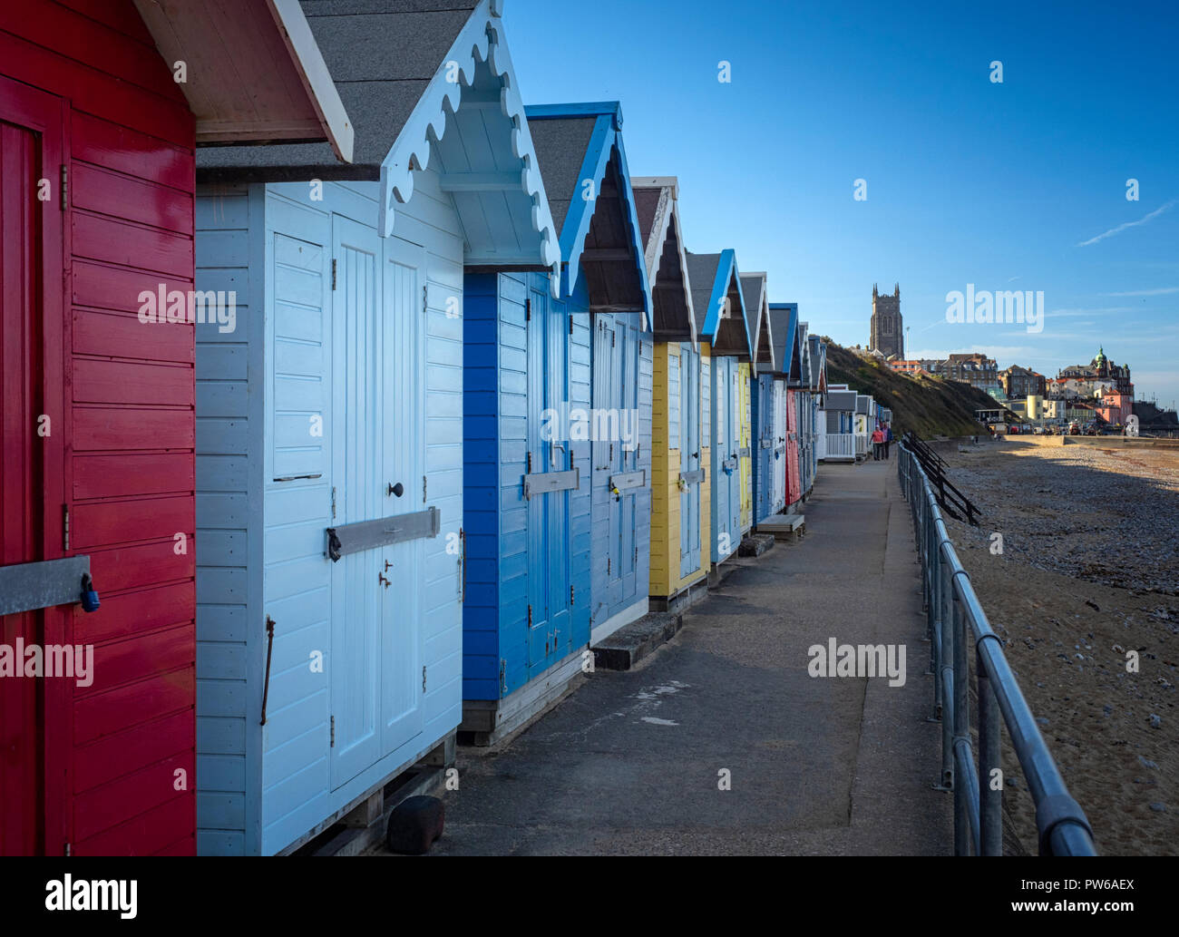 Colourful beach huts along the sandy shore at Cromer, north Norfolk ...