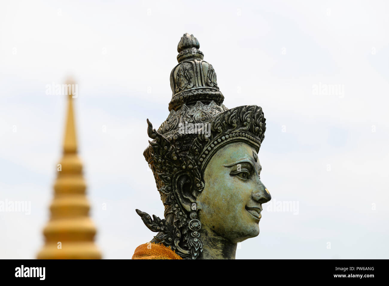 statue and temple spire in Bangkok city Stock Photo - Alamy