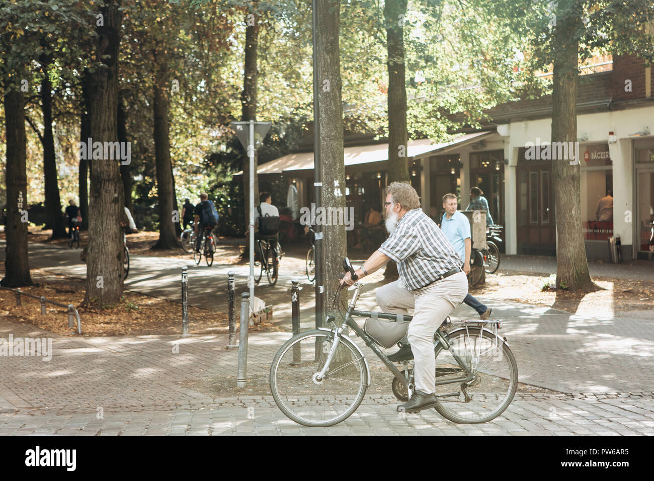 Germany, Muenster, October 5, 2018: A man on a bicycle rides a bike ...