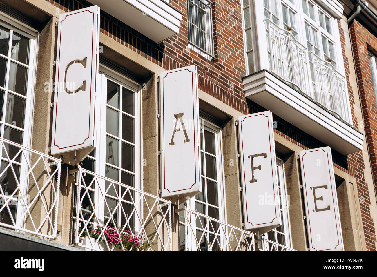 Cafe sign on the outside of the building Stock Photo - Alamy
