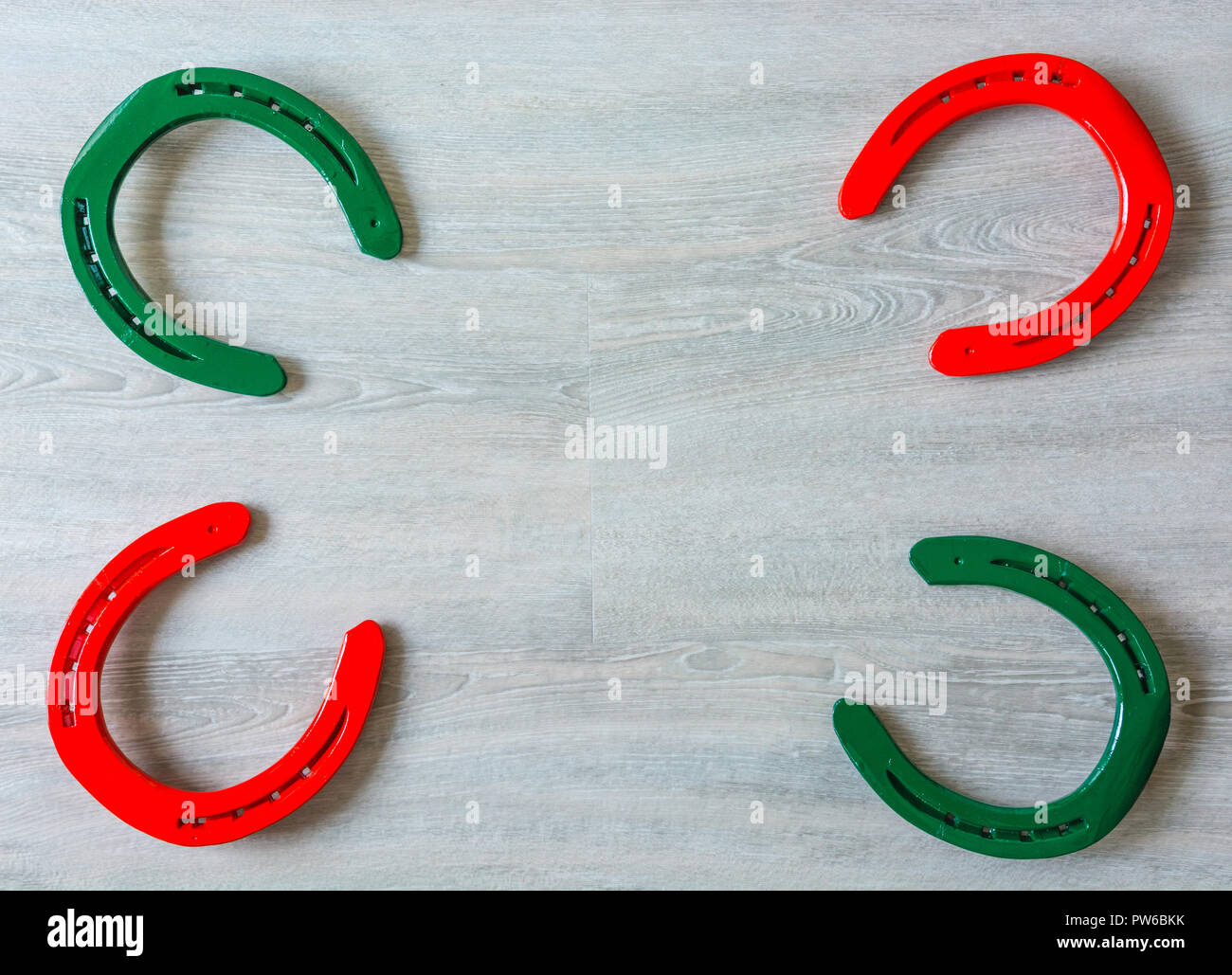 Green and red horseshoes forming a clover Stock Photo - Alamy