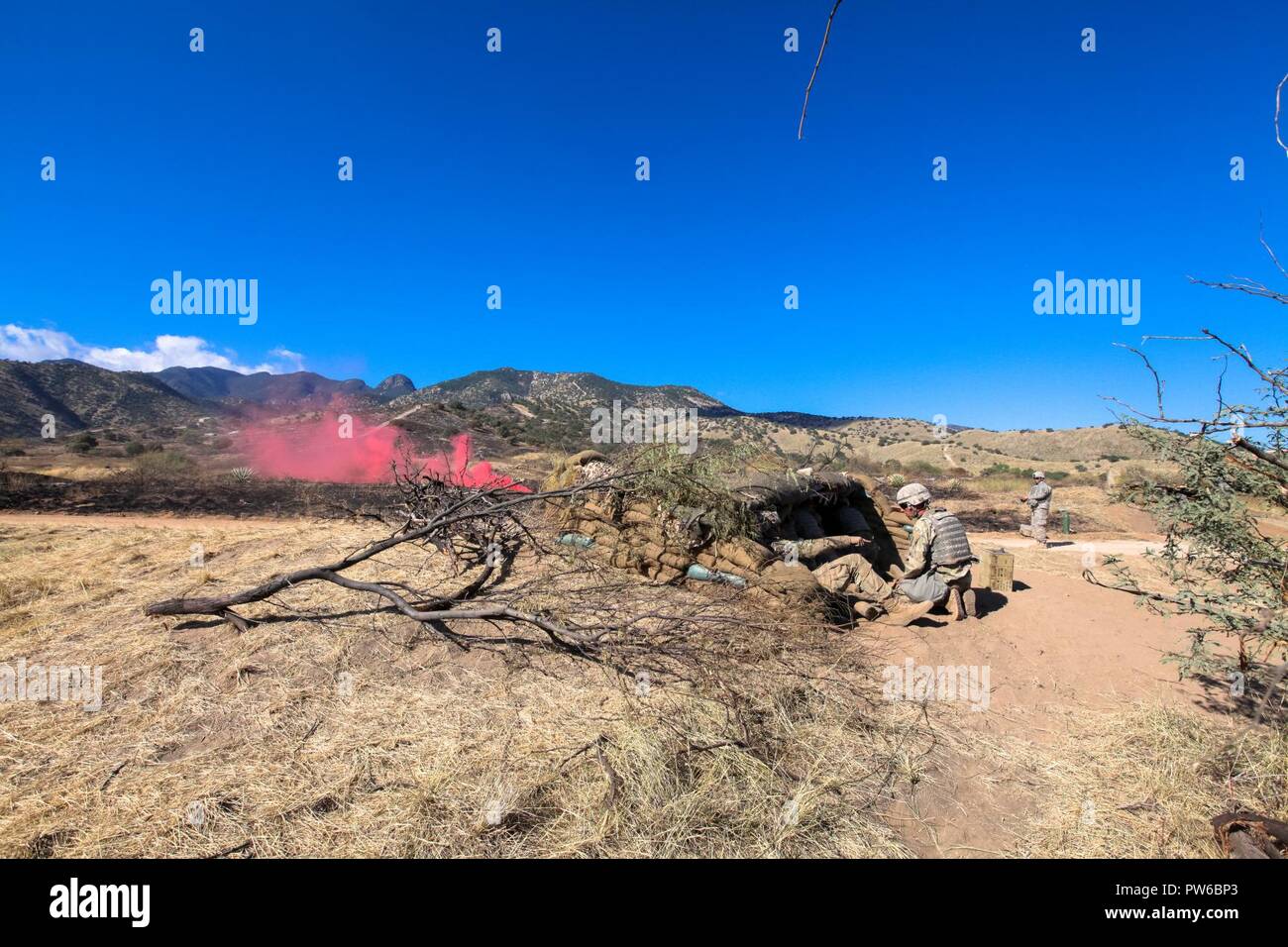 Alpha Company, 40th Expeditionary Signal Battalion conducts a live fire ...