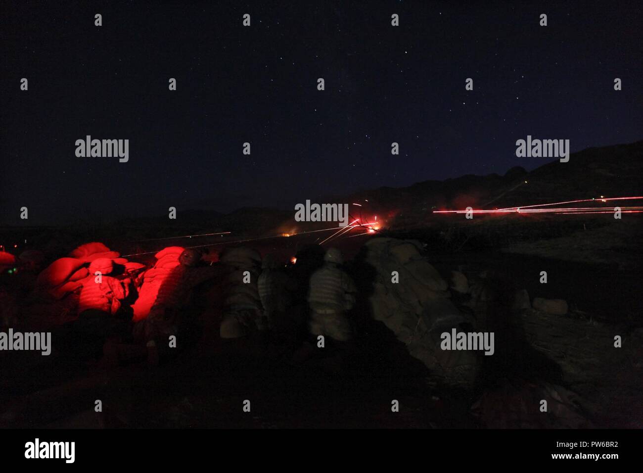 Alpha Company, 40th Expeditionary Signal Battalion conducts a live fire ...