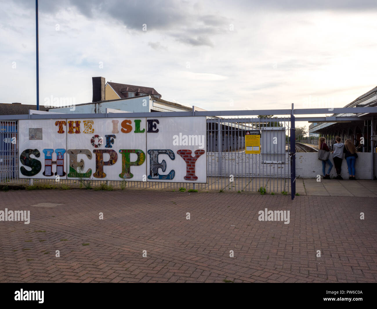 A welcome sign to The Isle of Sheppey outside the railway station at ...
