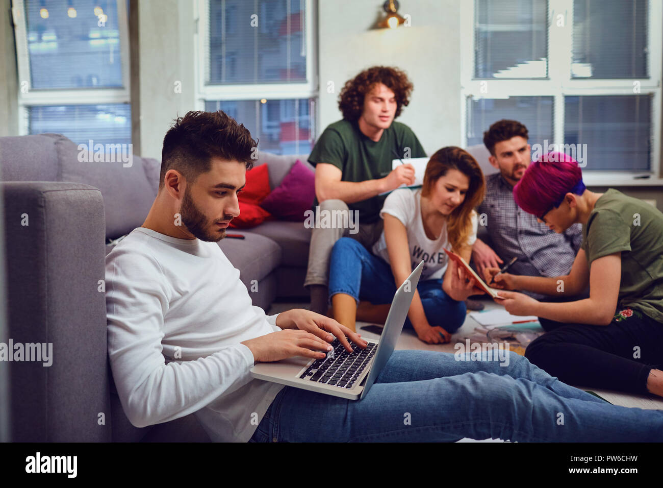 Student group discussion with laptop hi-res stock photography and ...
