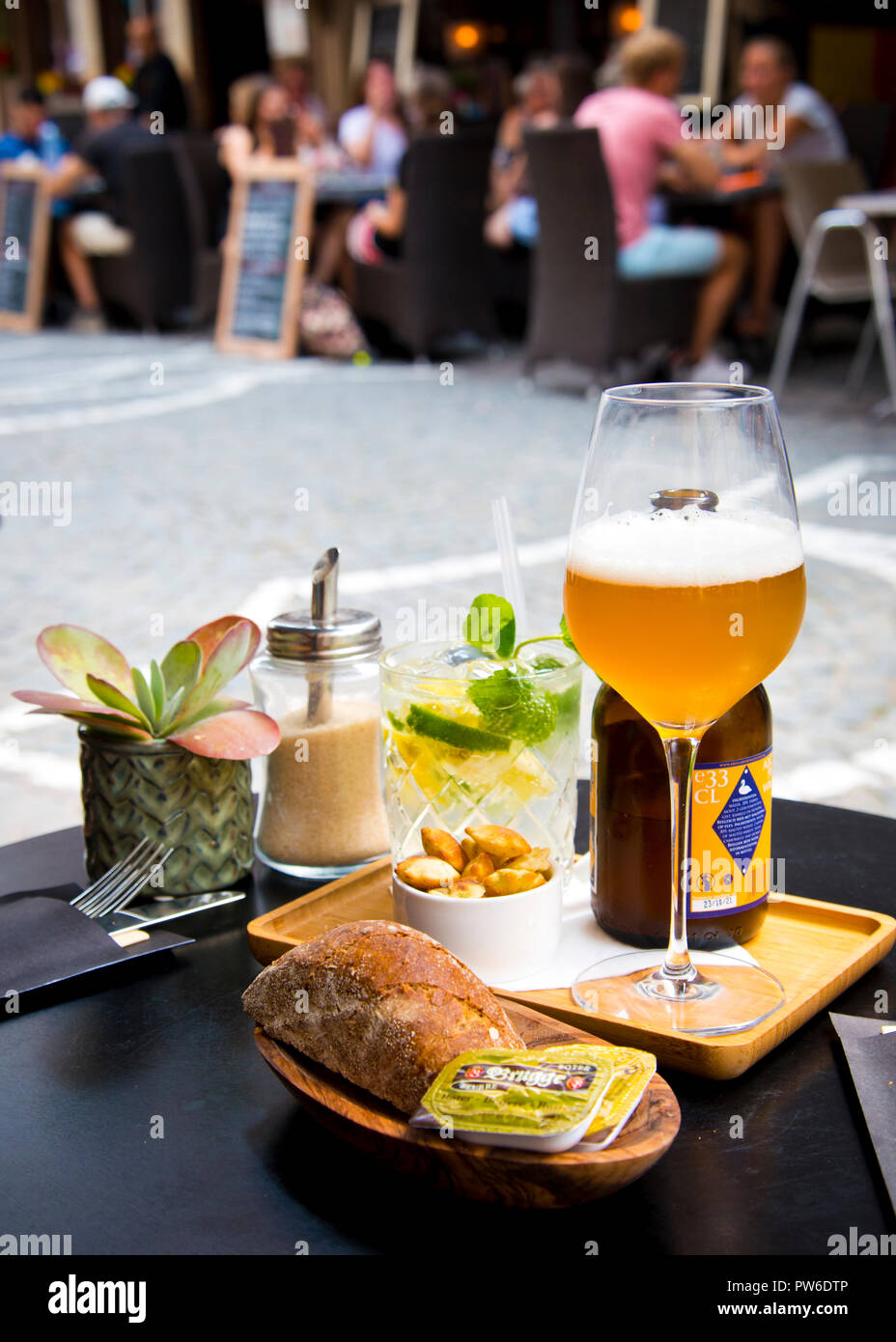 appetizers, alcoholic drinks, beer in glasses on round small table ...