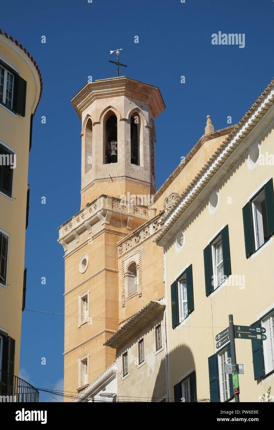 Iglesia de Santa Maria towers above apartments in the centre of Mahon ...