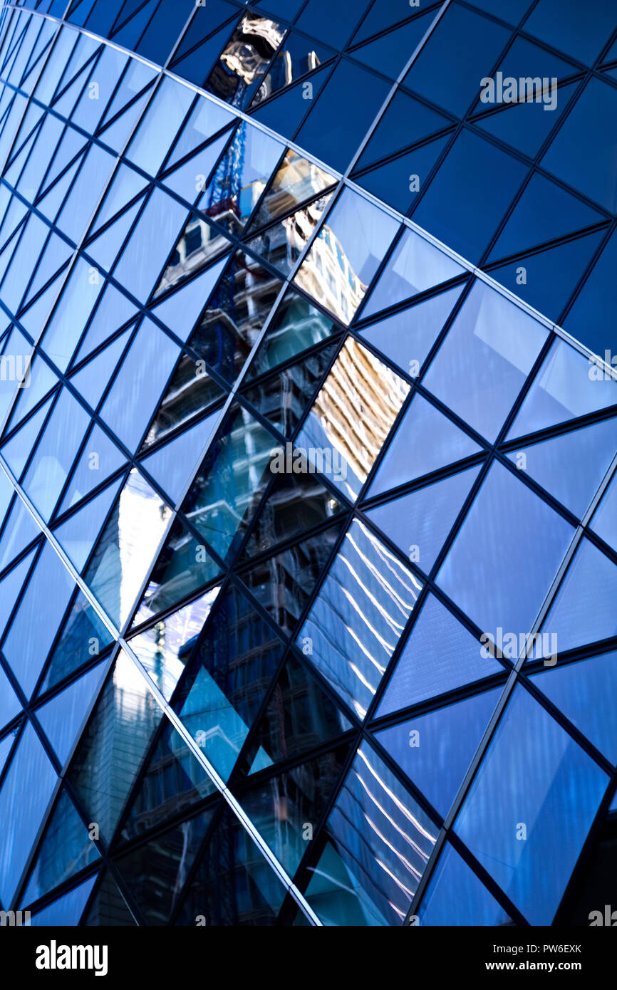 Reflections of City in the windows of Gherkin building London Stock ...