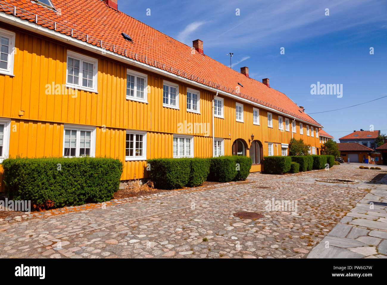 Ochre coloured historic building on old Stavern market square (Torvet ...