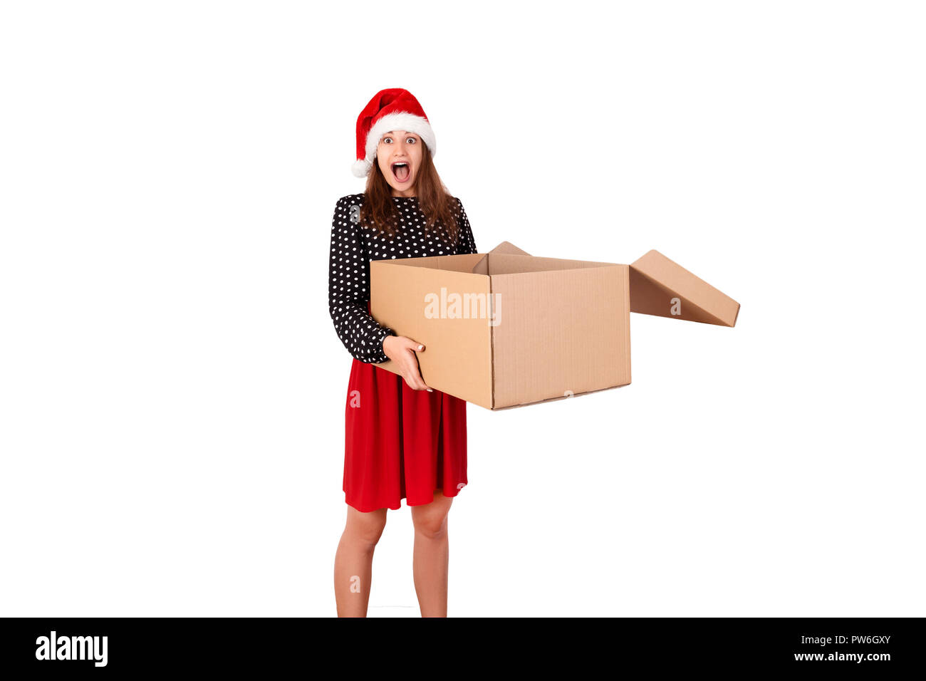 Shocked and surprised pretty young woman holding open big carton gift ...