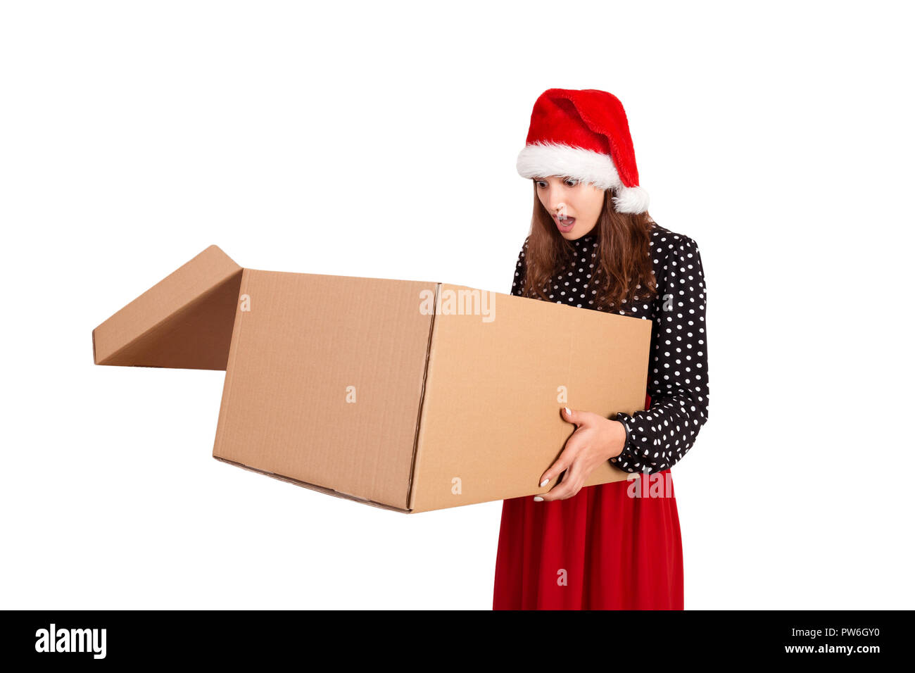 Shocked and surprised pretty young woman holding open big carton gift ...