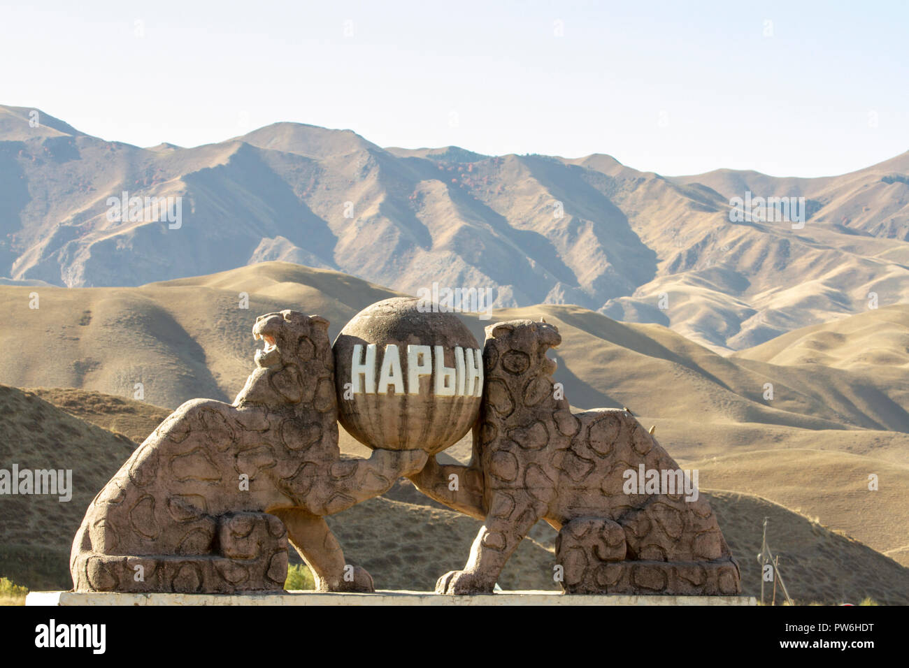Snow leopard symbol of Naryn on roadway sign in Kyrgyzstan Stock Photo ...