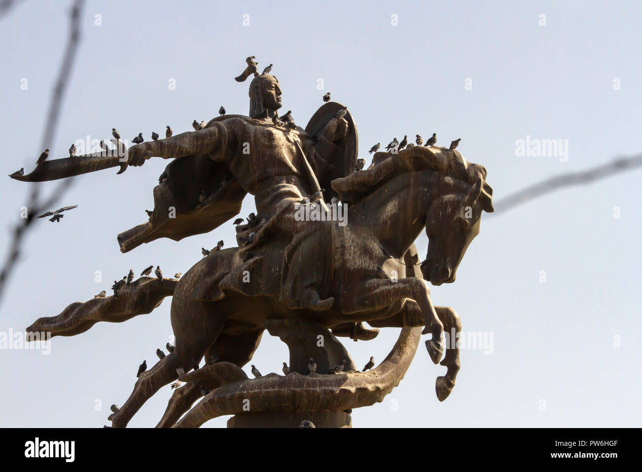 Pigeons on statue in Manas Monument in Bishkek, Kyrgyzstan Stock Photo ...