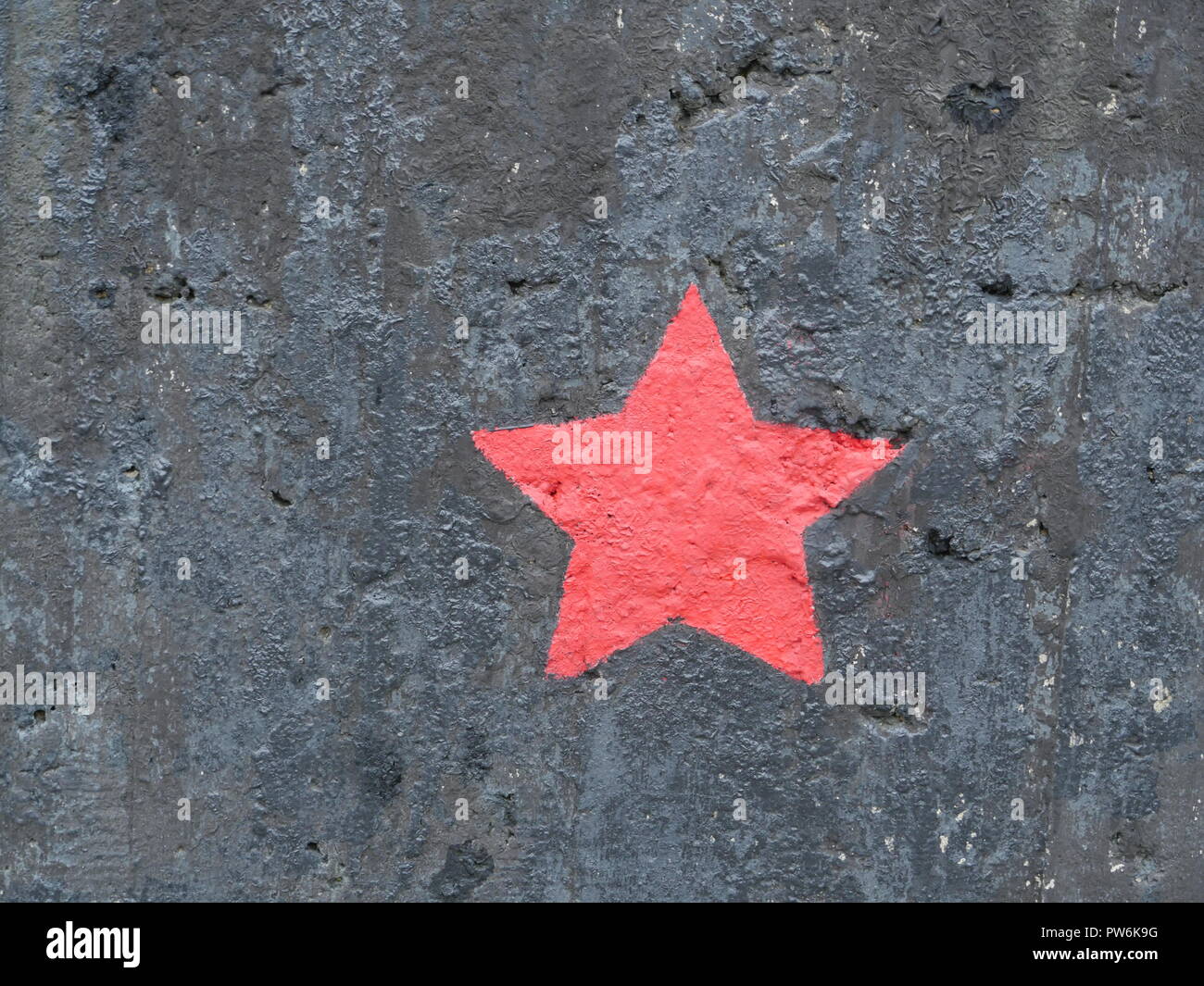 five-pointed red star on a black background Stock Photo - Alamy