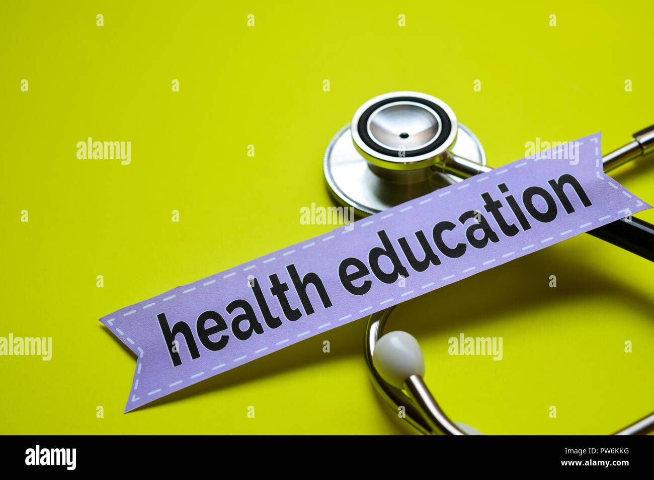 health education with stethoscope concept inspiration on yellow ...