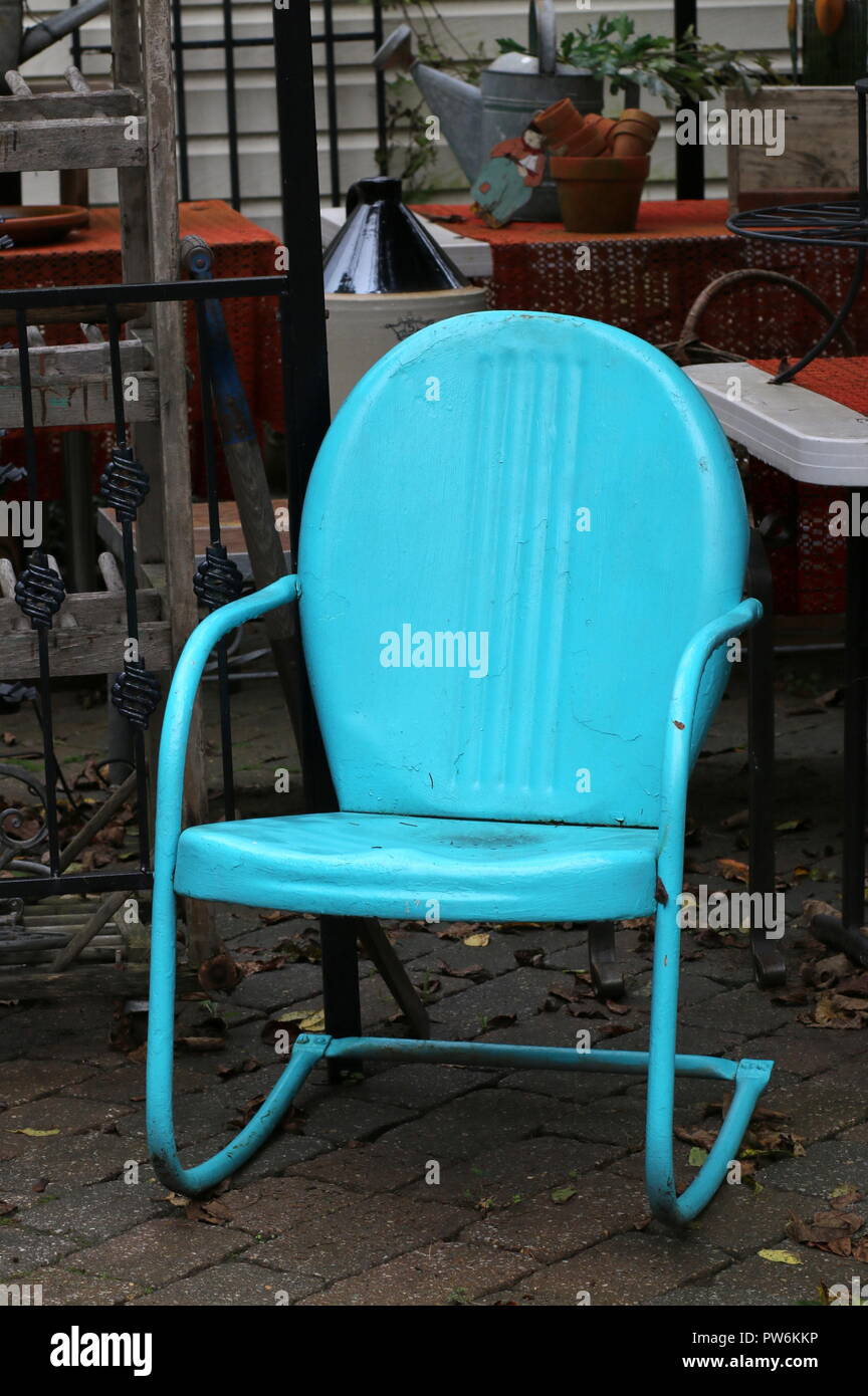 The blue antique chair is for sale at the antique shop Stock Photo - Alamy