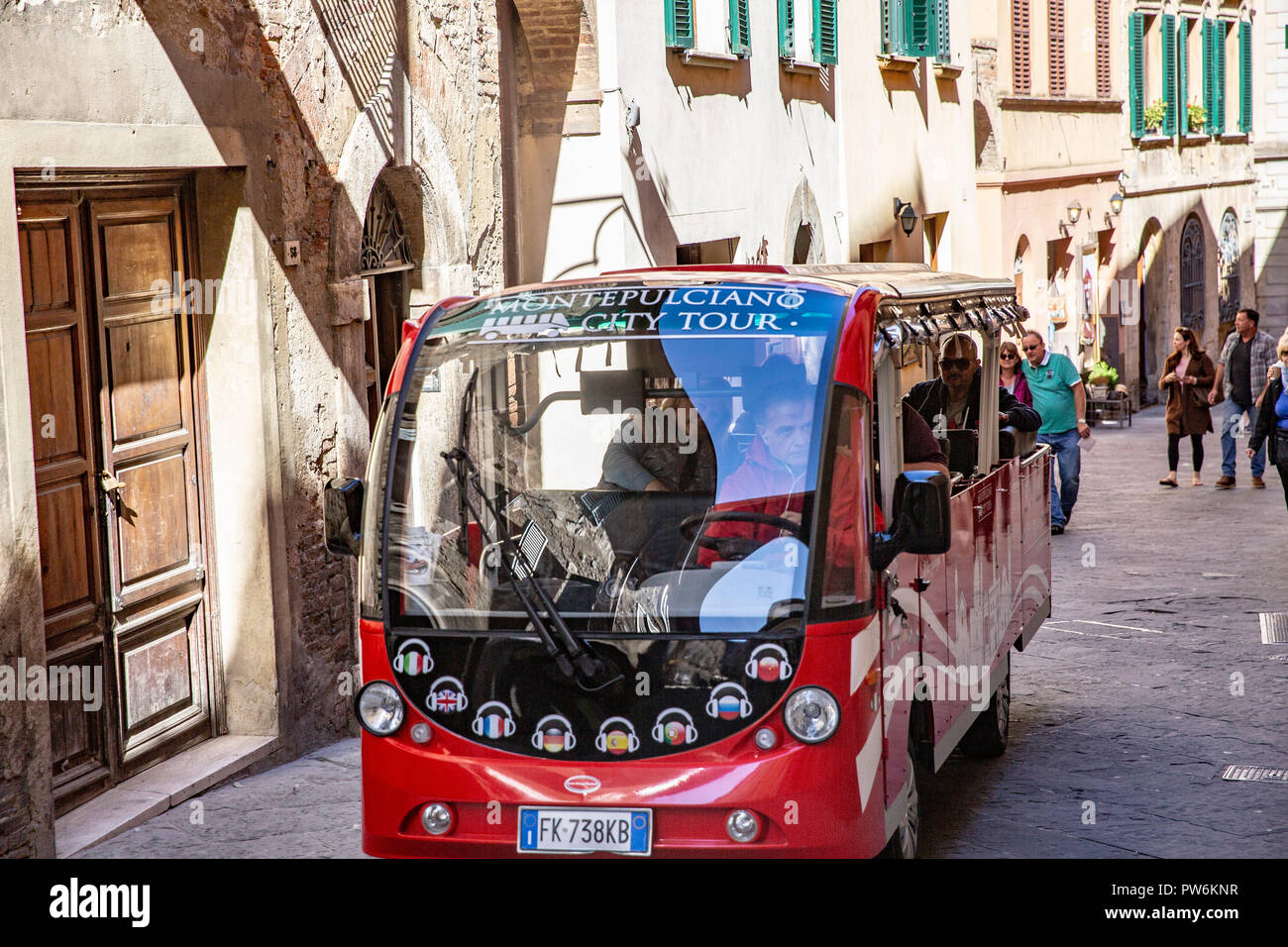 Tour bus sightseeing visitors around the streets of Montepulciano in ...