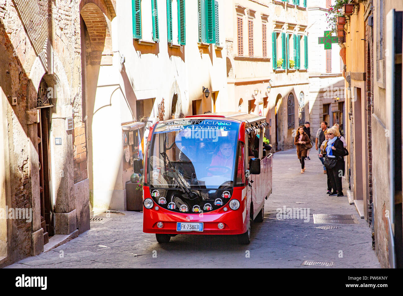 Tour bus sightseeing visitors around the streets of Montepulciano in ...