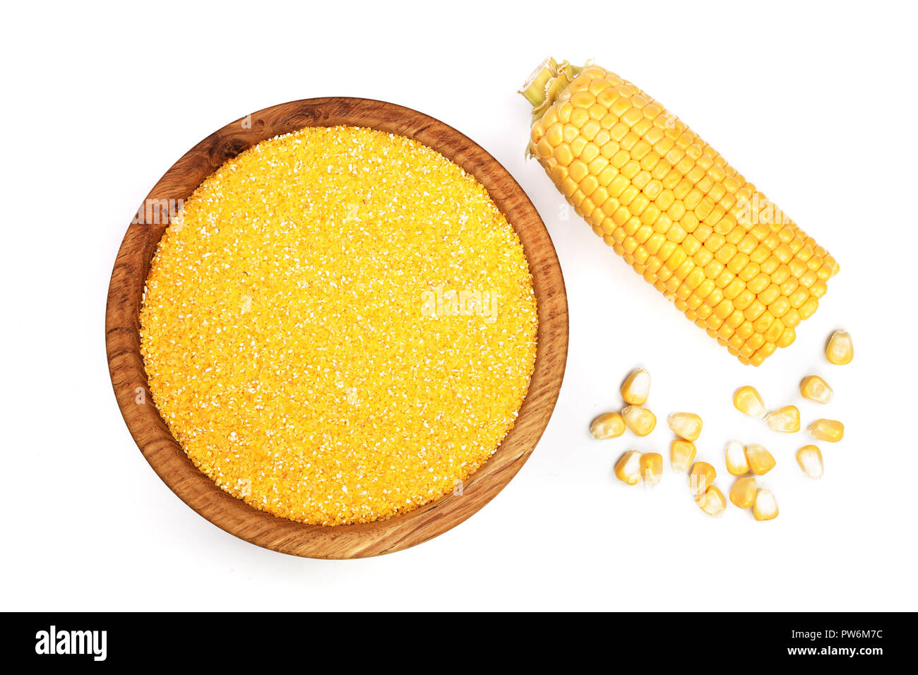 corn groats or cornmeal in wooden bowl and corncob isolated on white ...