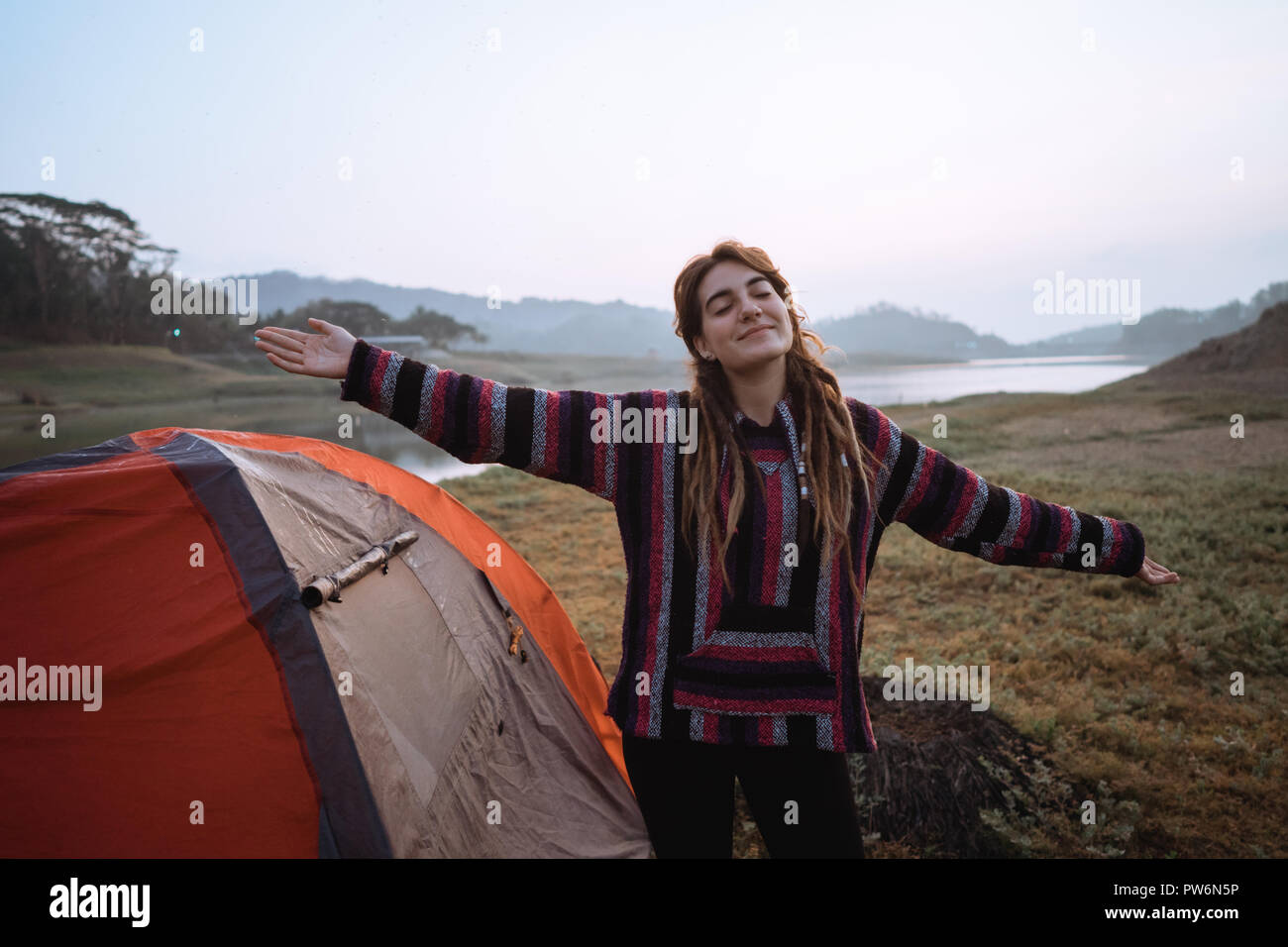 close up a woman enjoy the morning and rise arm Stock Photo - Alamy