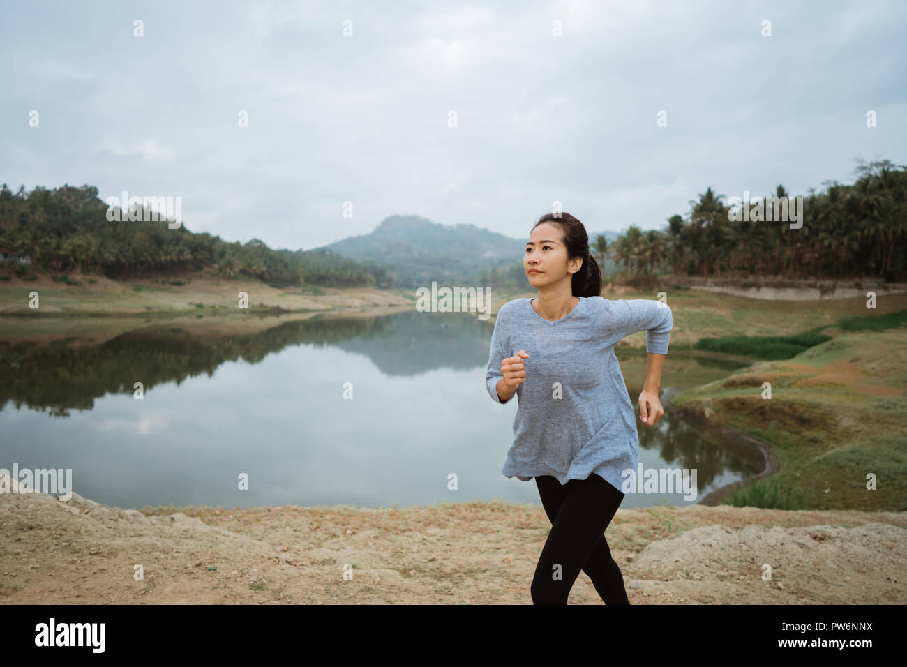 a woman ran in side river Stock Photo - Alamy