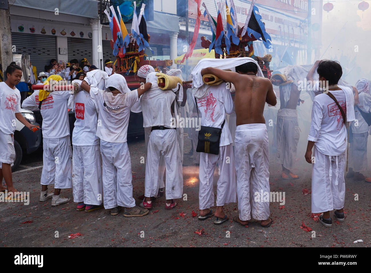Palanquin bearers in a procession during the Vegetarian Festival in ...