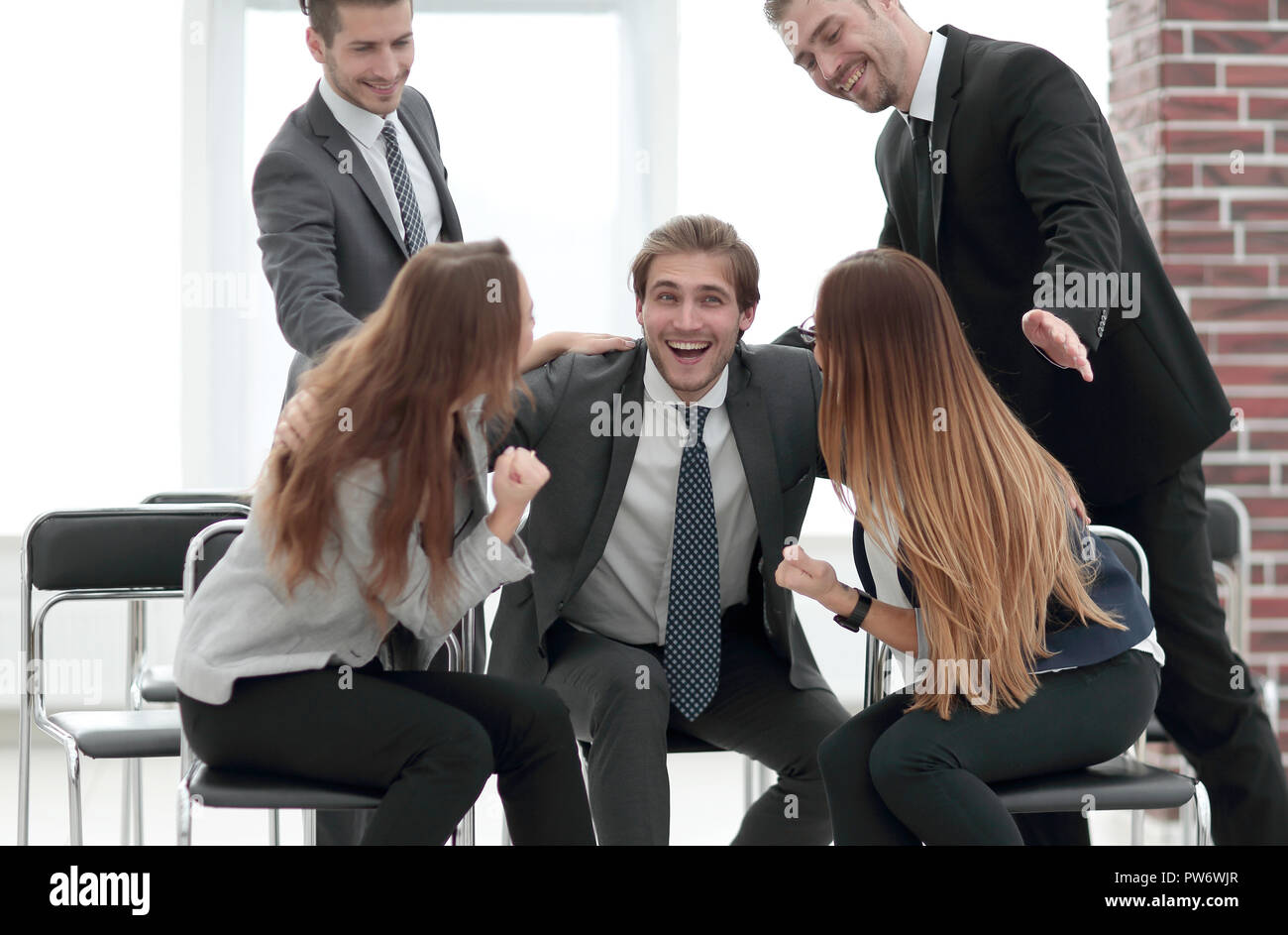 Hugging business people toasting to celebrate success Stock Photo - Alamy