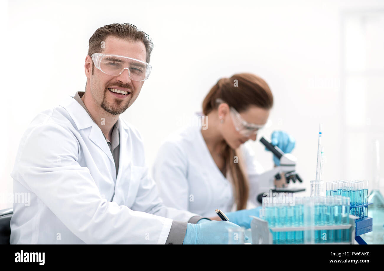two scientists biologists sitting at the laboratory table Stock Photo ...
