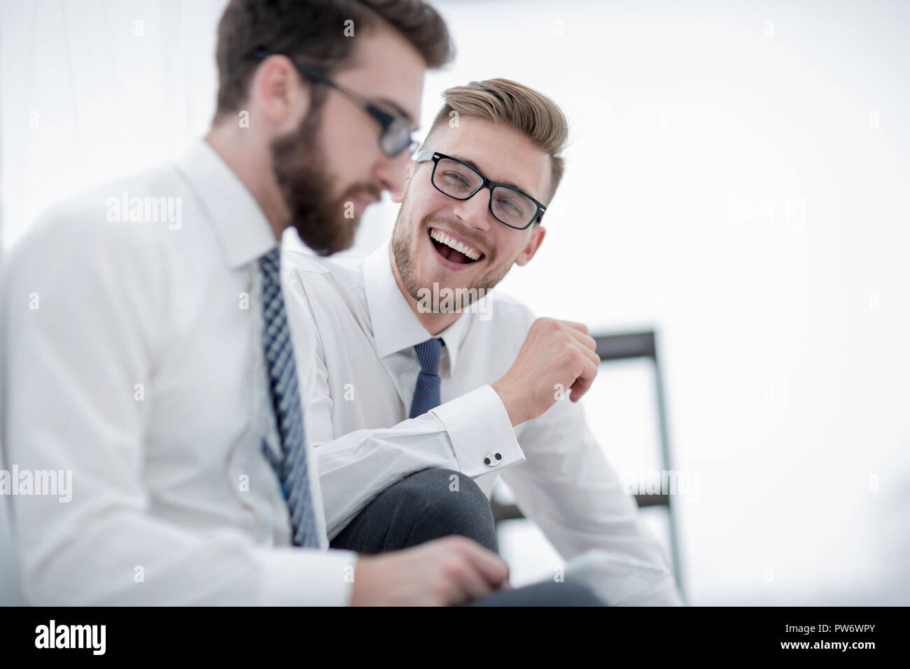 close up. two successful employees work together Stock Photo - Alamy