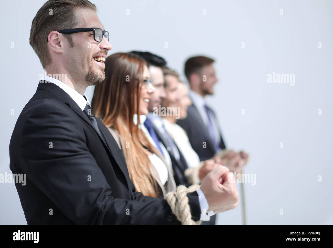 close up.a group of successful business people tied with one rope Stock ...