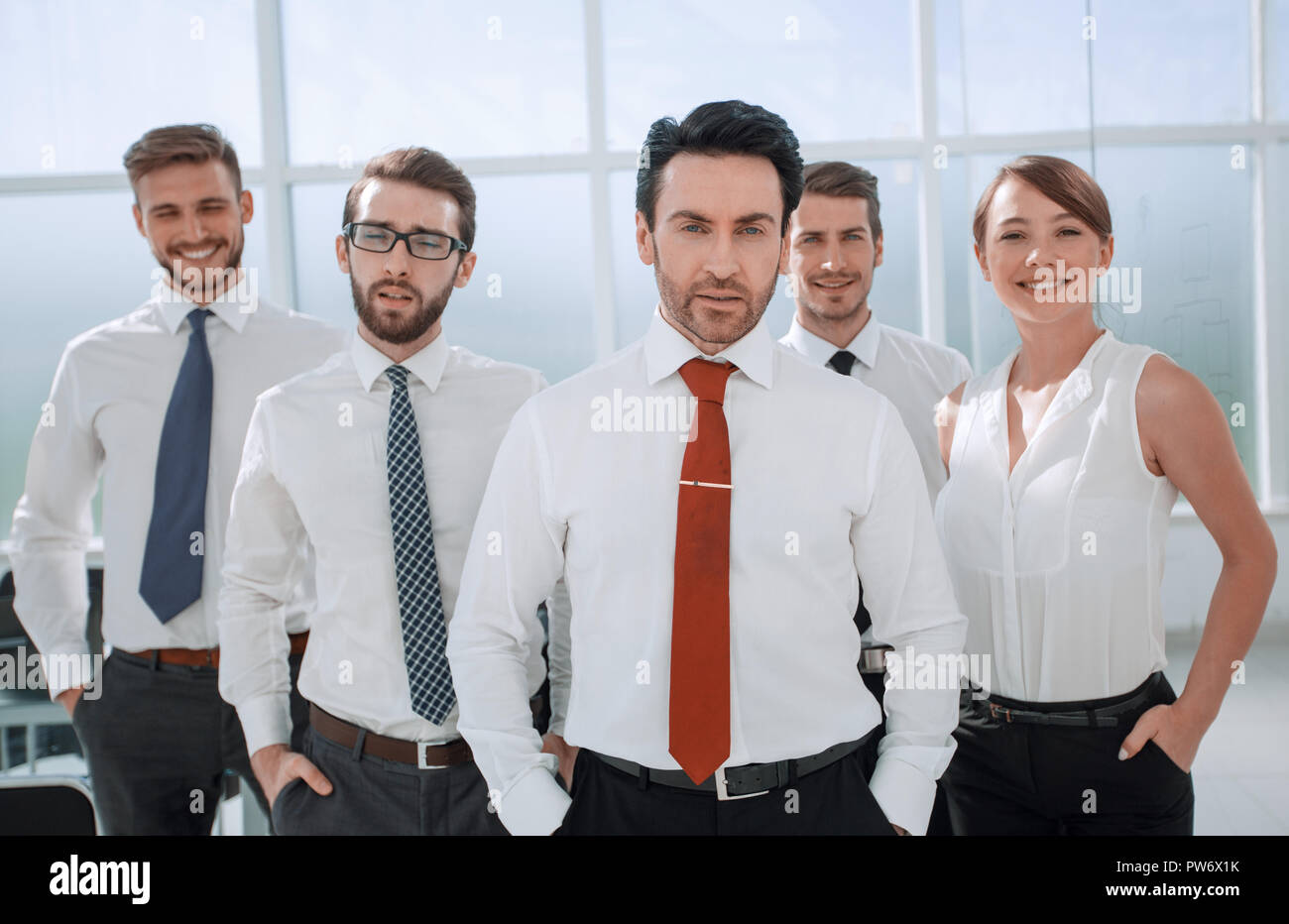 businessman standing in front of his business team Stock Photo - Alamy